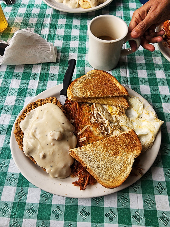 Chicken fried steak with gravy so good it should have its own ZIP code. The toast is just there to soak up your tears of joy.