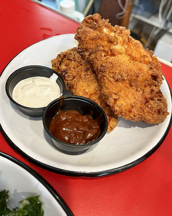 Fried chicken that's achieved the impossible trifecta &ndash; crispy exterior, juicy interior, and the power to make you forget your table manners.