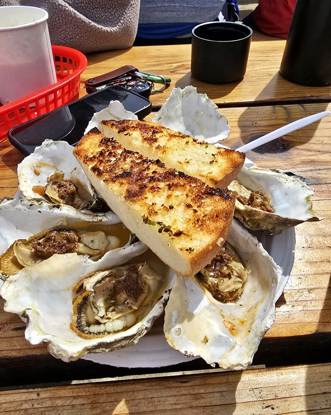 Grilled oysters with garlic bread &ndash; the ocean and land coming together in a dish that makes you want to high-five strangers.