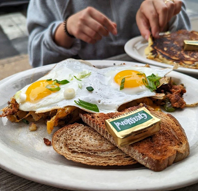 Two sunny-side-up eggs keeping watch over a hash that might just make chorizo your new breakfast spirit animal.