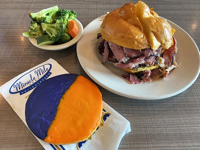 A study in contrasts! The towering Chris Paulstrami sandwich stands proudly beside a cookie sporting Phoenix Suns colors &ndash; local pride never tasted so good.