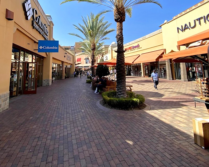 Columbia and its neighbors create a retail canyon of outdoor brands, brick pathways leading shoppers to their next adventure gear discovery.