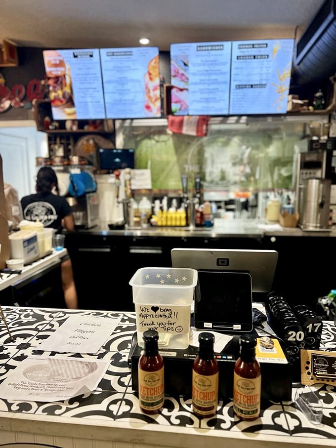 The counter tells the story&mdash;artisanal ketchup bottles standing at attention, ready to elevate your fry experience beyond the ordinary red squeeze bottle.