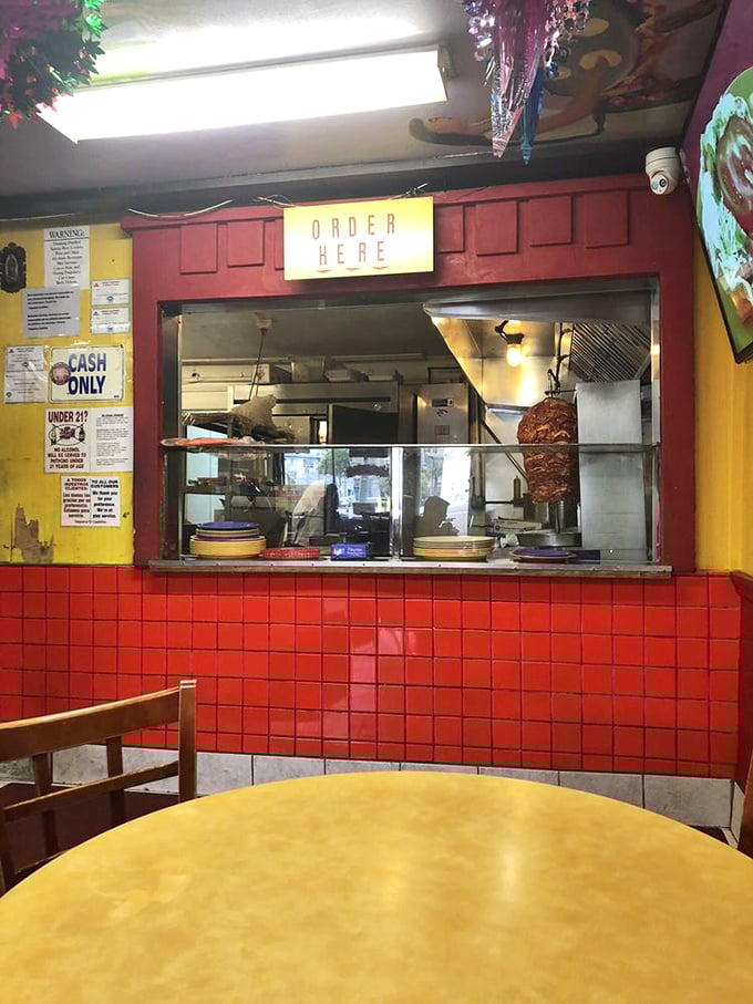 Where the magic happens. That "ORDER HERE" sign might as well say "HAPPINESS BEGINS HERE" as you glimpse the al pastor spinning behind the counter.