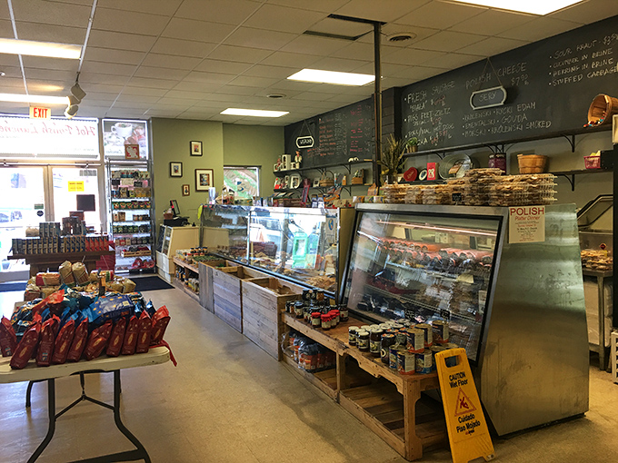Behind this counter, culinary magic happens daily. The glass cases protect treasures more valuable than gold: homemade Polish specialties waiting for their forever homes.