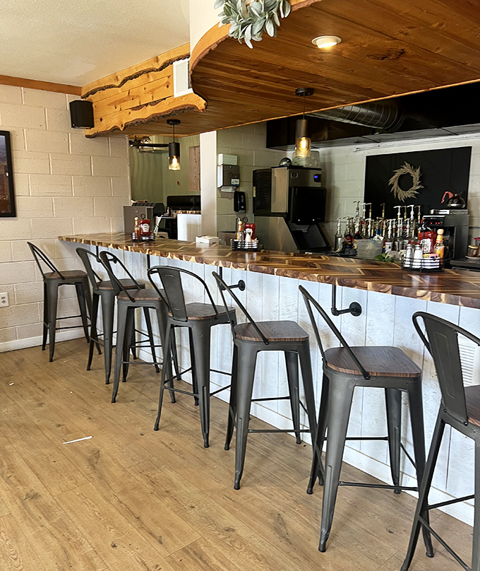 The counter area features live-edge wood and industrial-style seating &ndash; rustic elegance that perfectly frames your morning coffee experience.