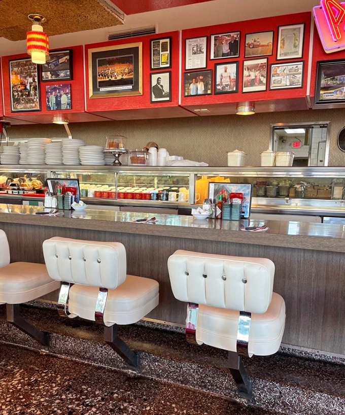 Counter seats where solo diners find community and regulars have "their spot." Some of these stools could write memoirs about the conversations they've heard.