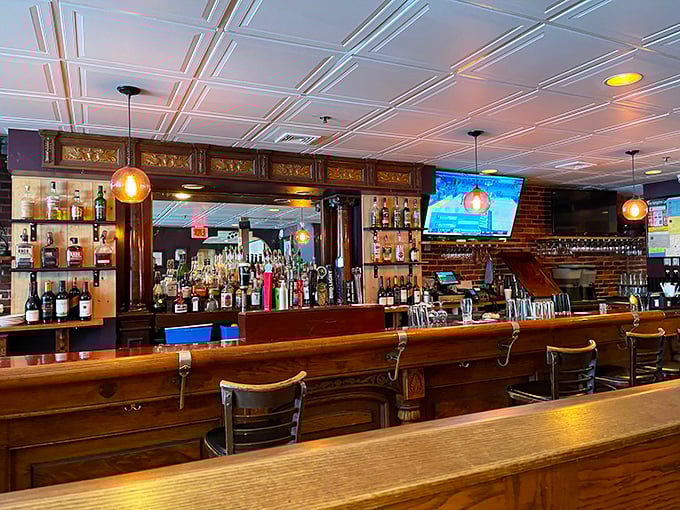 A bar that invites you to pull up a stool and stay awhile &ndash; polished wood that's seen its share of elbows and stories.