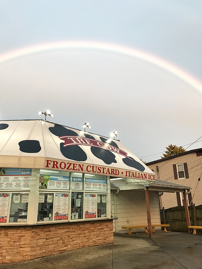 Even rainbows approve of The Cow! Nature's seal of approval arches over this temple of frozen custard perfection.