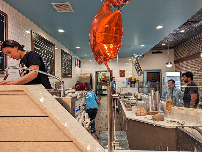 Balloon celebrations and custard creations&mdash;clearly someone knows how to party. The pristine prep area hints at the precision behind each scoop.