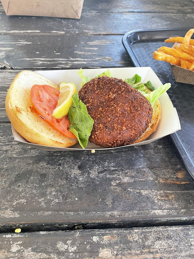 This isn't just a crab cake sandwich&mdash;it's architecture. The structural integrity of that perfectly browned patty deserves an engineering award. 