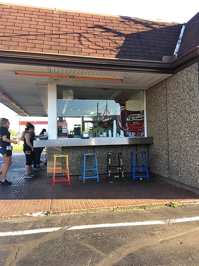 The walk-up window experience: where strangers become temporary friends united by their quest for root beer perfection.