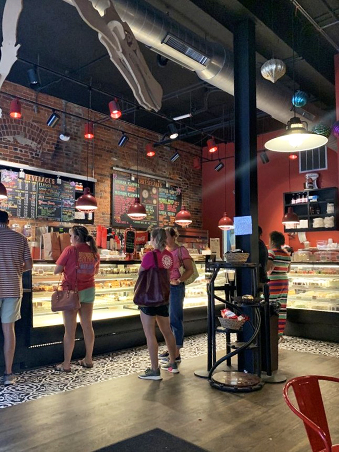 The universal language of anticipation: customers lined up at the counter, each one about to experience that first-bite euphoria that makes Monday feel like Friday.