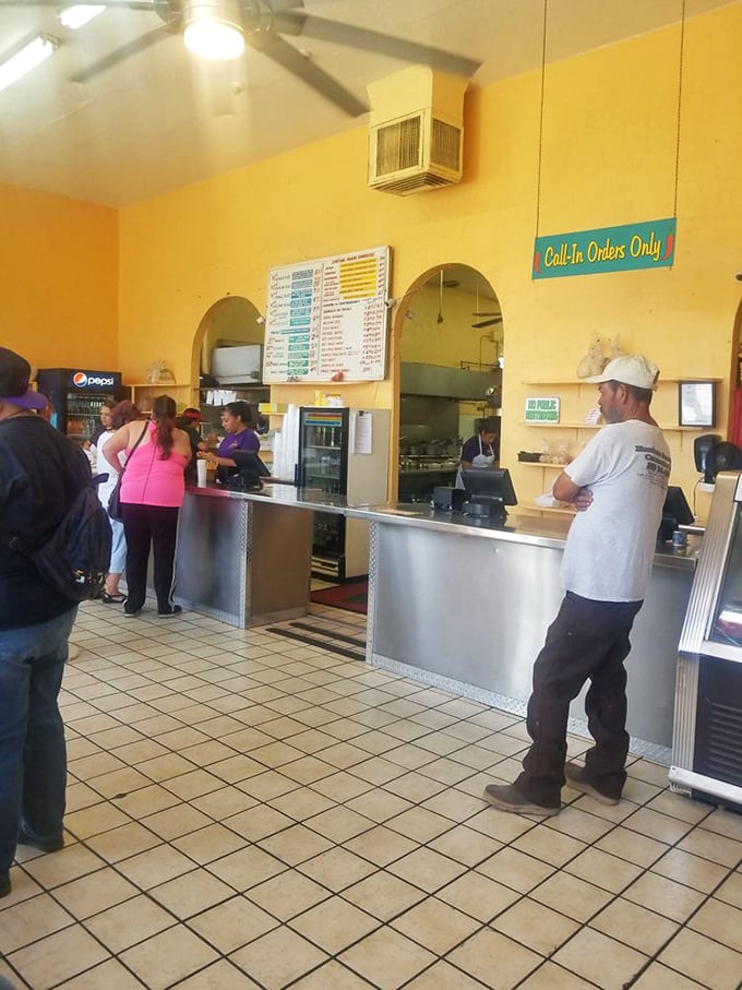 The diverse crowd at the counter tells you everything: when both construction workers and office professionals agree, you know it's good.