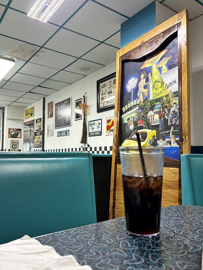 Turquoise booths and nostalgic wall art create the perfect backdrop for conversations that meander like Sunday drives through small-town America.