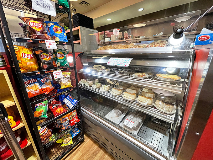 The dessert case stands guard next to chip racks&mdash;ensuring your meal can end with either a sweet symphony or a salty crunch.