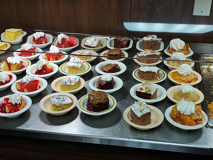 The dessert section: where "I'll just have a bite" becomes "I need all of these" faster than you can say peach cobbler.