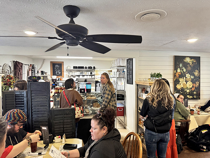 The bustling interior captures that perfect restaurant energy where good food brings strangers together in shared culinary appreciation.