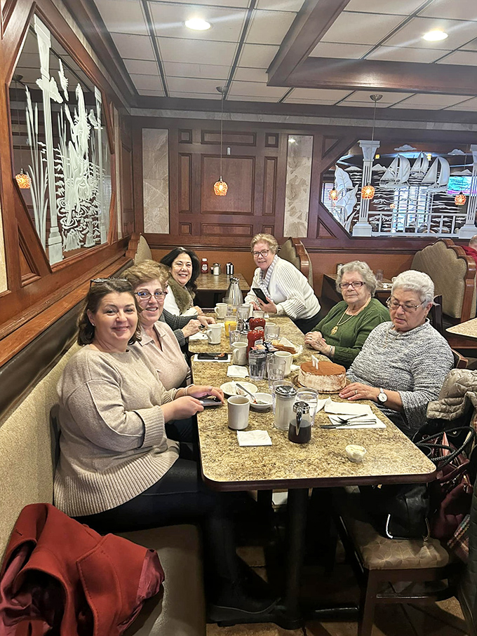 A gathering of friends around a diner table &ndash; proof that the best social network has always been the one that comes with coffee and conversation. 