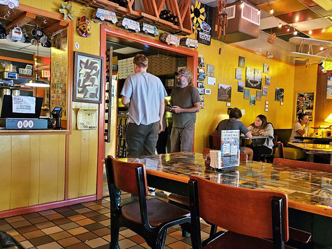 The tables have stories to tell. With collage-covered surfaces and cheerful yellow walls, every seat at Satchel's offers a different perspective on quirky perfection.