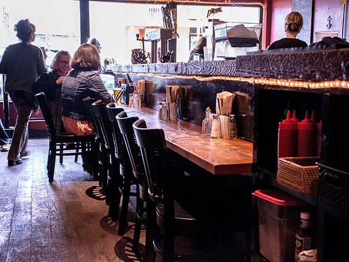 The bar at The Anchor—where strangers become friends over shared love of perfectly fried cod and well-poured pints.