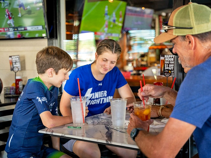 Three generations sharing stories over straws. This is what restaurants are really about—creating moments that outlast the meal itself.