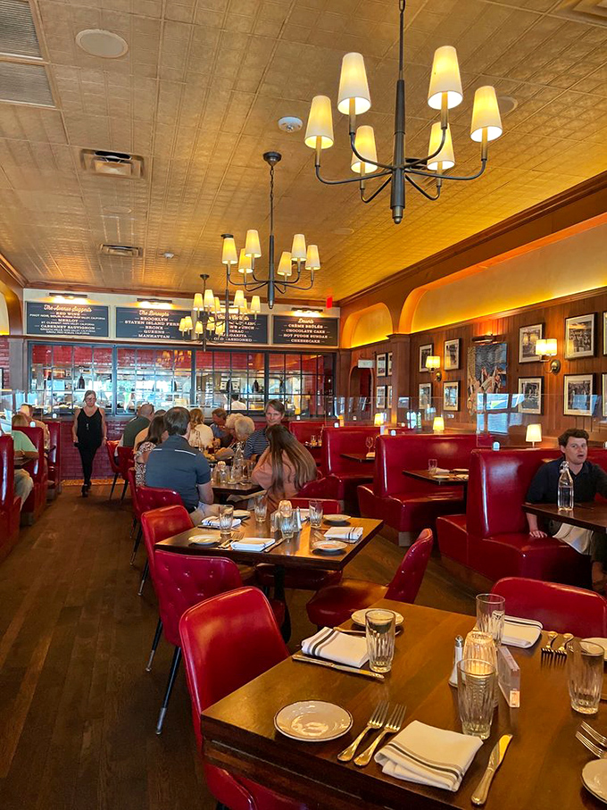 The dining room hums with satisfaction. Those red booths have witnessed countless celebrations, business deals, and first dates.