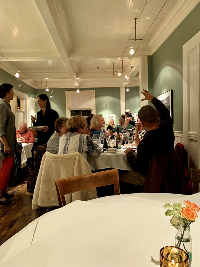 Happy diners sharing stories and laughter, because the best restaurants create communities one delicious meal at a time.