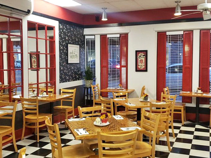Red accents and wooden chairs create the perfect backdrop for the serious business of cake appreciation.