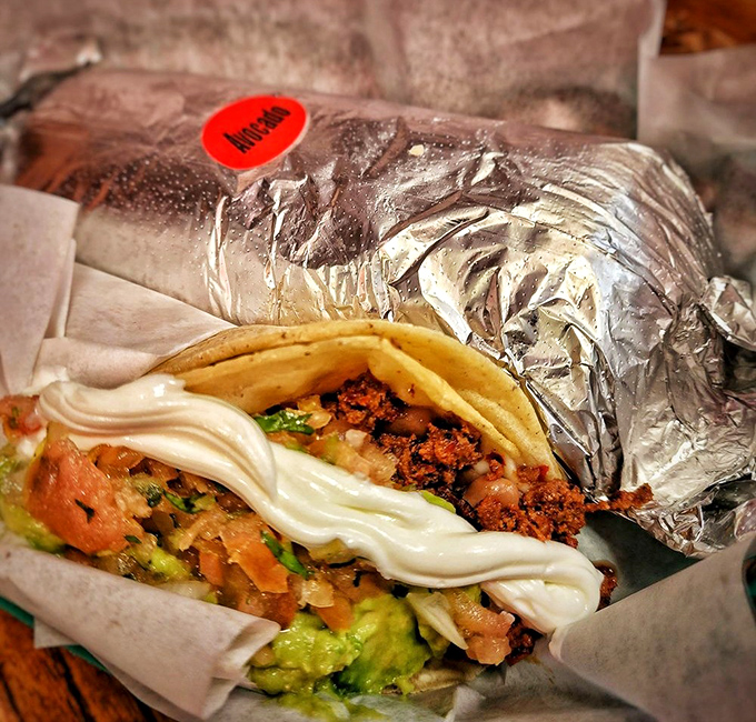 Half-unwrapped like a present to your taste buds. The strategic ribbon of sour cream adds creamy contrast to the savory filling.