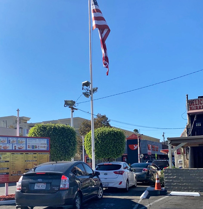 Cars line up like pilgrims at a shrine. The drive-through experience at El Huero is worth every minute of the wait.