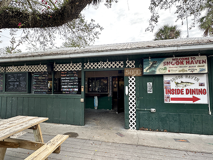 The green facade welcomes hungry adventurers. Snook Haven's entrance may be humble, but behind that door lies a feast worthy of a Florida folk hero.