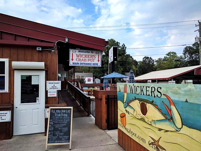 The weathered wood exterior and cheerful signage promise authentic coastal dining without pretense. This entrance has welcomed seafood pilgrims for generations.