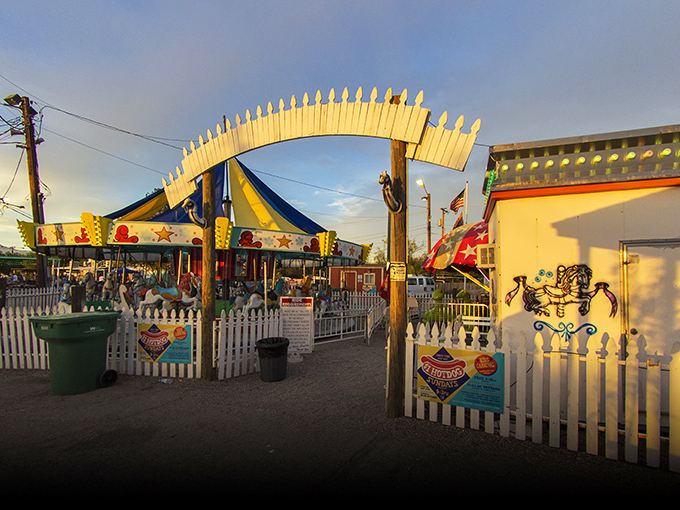 The carnival entrance beckons with promises of rides, games, and that special kind of old-fashioned American fun. 