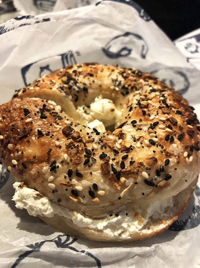 An everything bagel with cream cheese—the Swiss Army knife of breakfast options. Ready for anything, perfect for everything.