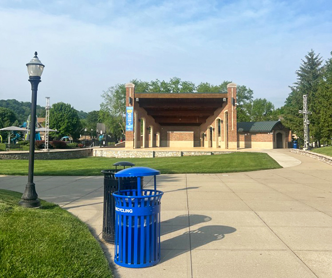 Village Green Park's amphitheater waits patiently between performances, a community stage where local talents and summer evenings find perfect harmony.