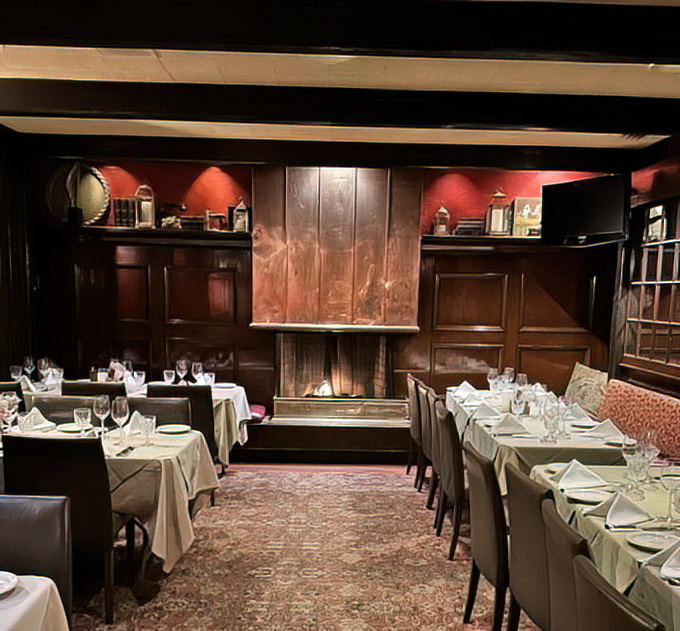 The fireplace room offers a cozy corner where you can pretend you're dining in an English manor, minus the drafty windows and aristocratic snobbery.