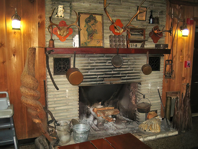 That fireplace has witnessed more happy food moments than most wedding venues. If walls could talk, these would just say "You're welcome."