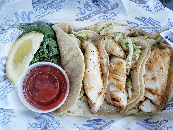 Fish tacos that deliver a perfect trilogy: flaky white fish, crunchy slaw, and just enough spice to make you contemplate ordering another round.