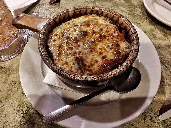 French onion soup so good it should require a passport. That cheese pull could win Olympic medals for both distance and artistic impression.