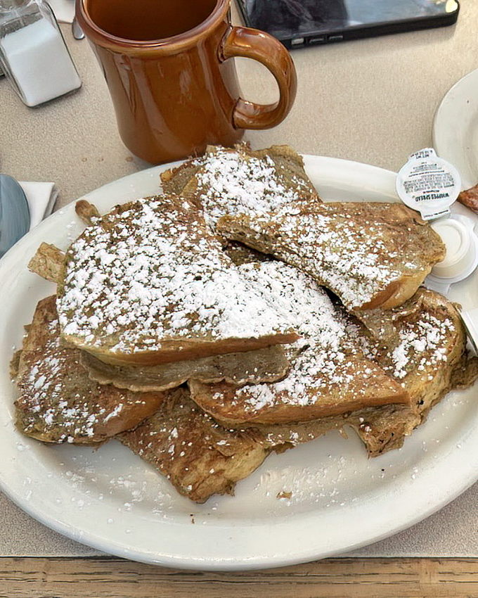 French toast that's been powdered so generously it looks like it just returned from a ski trip in Aspen.