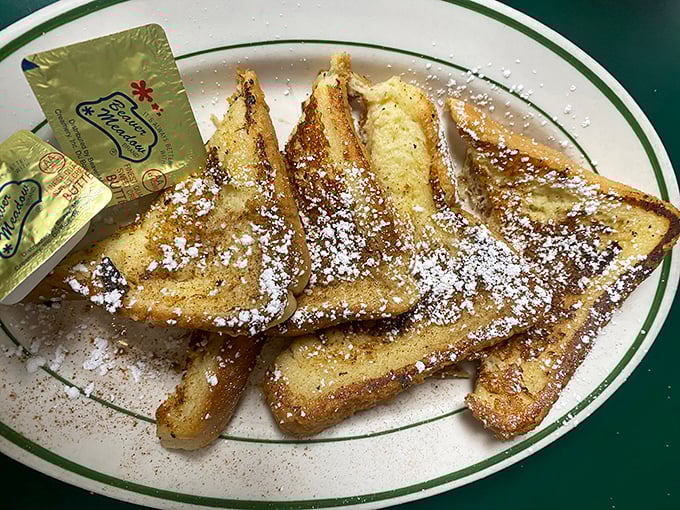 French toast that makes you question why you ever settled for regular toast. That powdered sugar sprinkle is pure breakfast confetti.