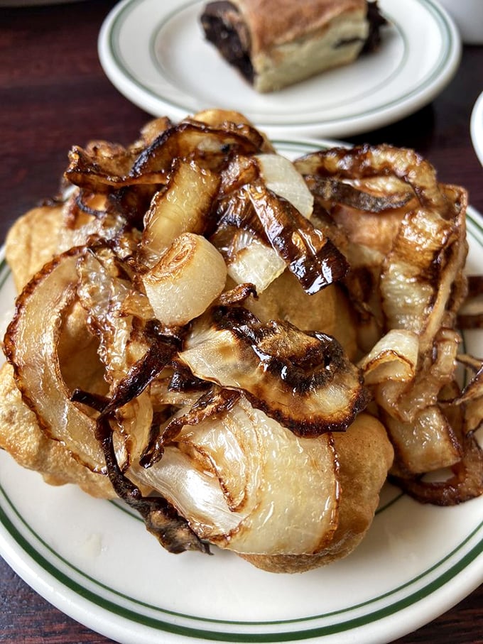 These aren't just fried onions&mdash;they're caramelized flavor bombs that transform from humble roots to crispy, sweet delights worthy of their own fan club.