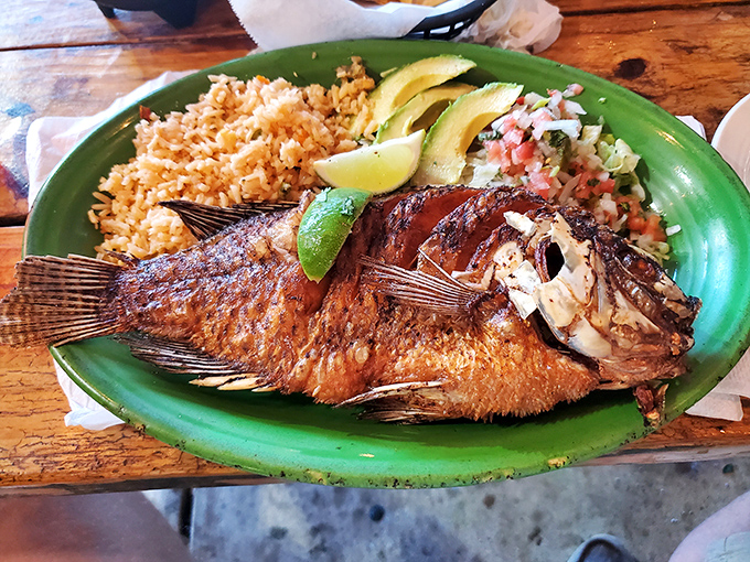 This whole fried fish stares back at you as if to say, "Yes, I'm delicious, and yes, I'm worth getting your hands messy for."