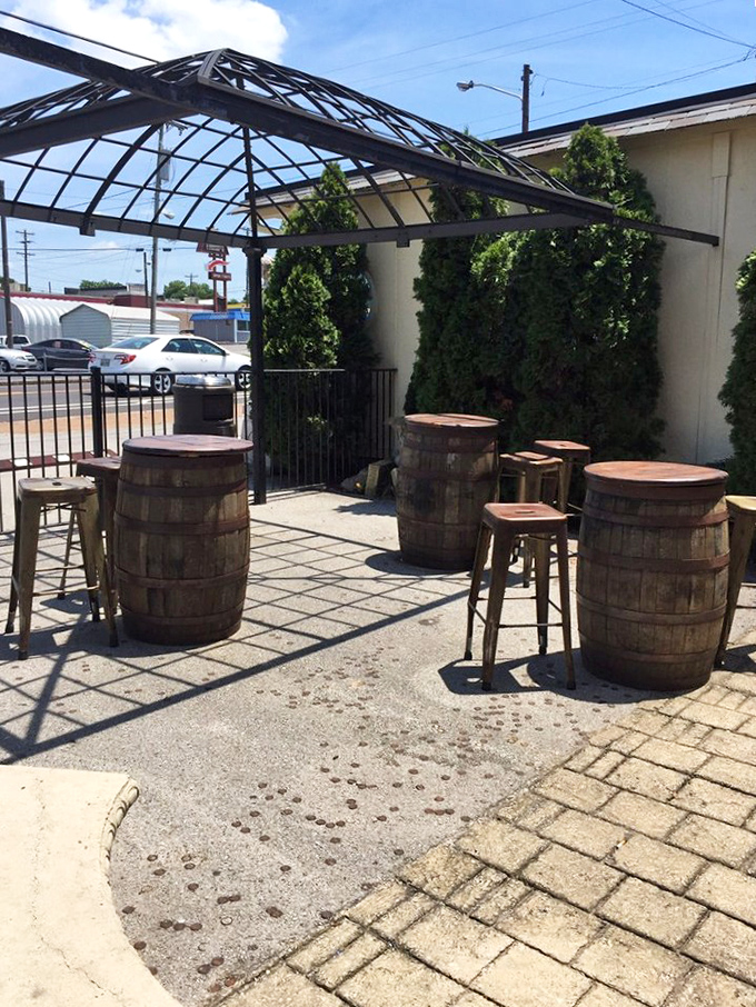 Wine barrel tables create the perfect rustic atmosphere for sipping Chianti and pretending you're in a Tuscan vineyard instead of Nashville.