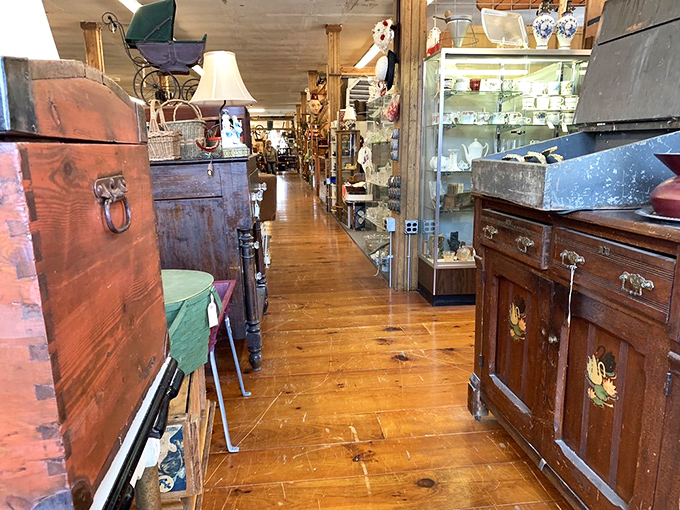 Wooden floors and antique furnishings create pathways through history, each booth a chapter in America's design story.