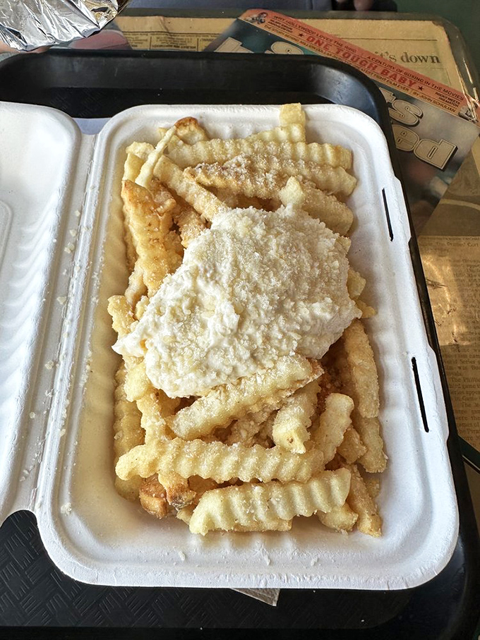 Garlic parmesan fries that make sharing impossible. "I'll just have one" becomes the biggest lie you'll tell yourself all day.