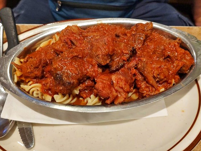 Pasta swimming in rich, meaty sauce that would make an Italian grandmother nod in approval. Comfort in a silver dish.