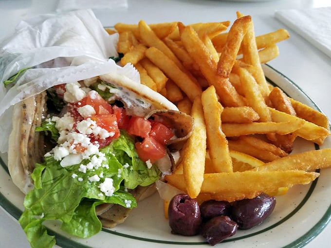 A Greek-inspired wrap that brings Mediterranean flavors to the Sunshine State, complete with crispy fries and briny olives for good measure.
