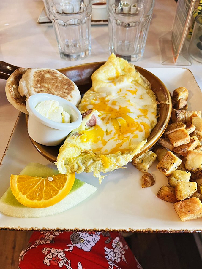Breakfast perfection on rustic stoneware&mdash;where eggs, cheese, and potatoes unite in the holy trinity of morning satisfaction.